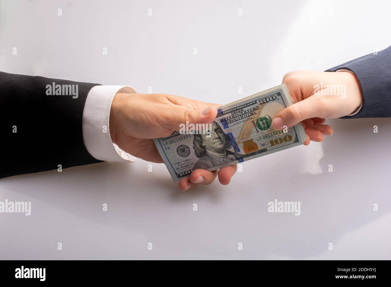 Businessman giving and receiving US dollar banknote money Stock Photo ...
