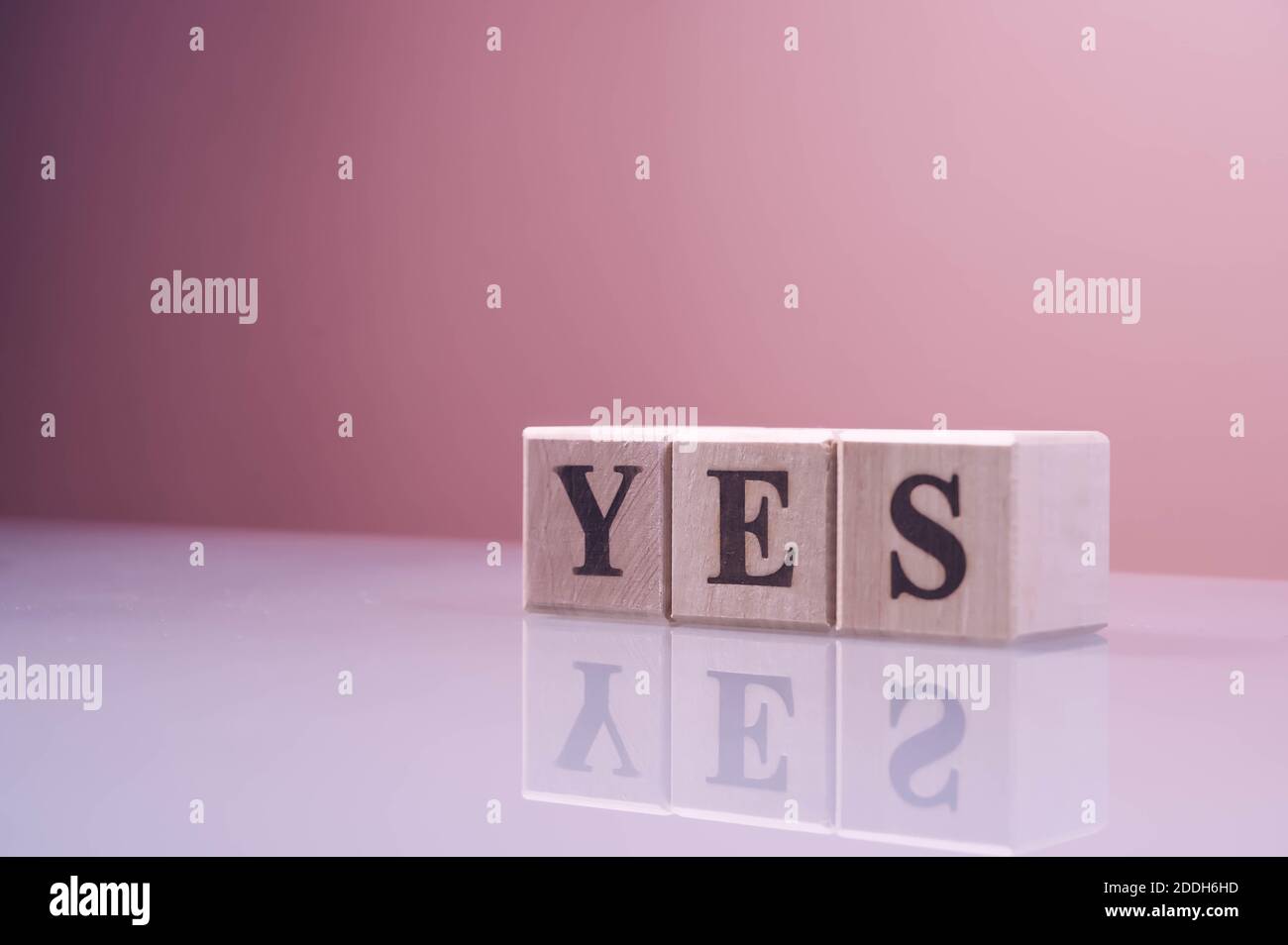 Text YES on wood cube blocks. The letters YES written on the cubes in ...