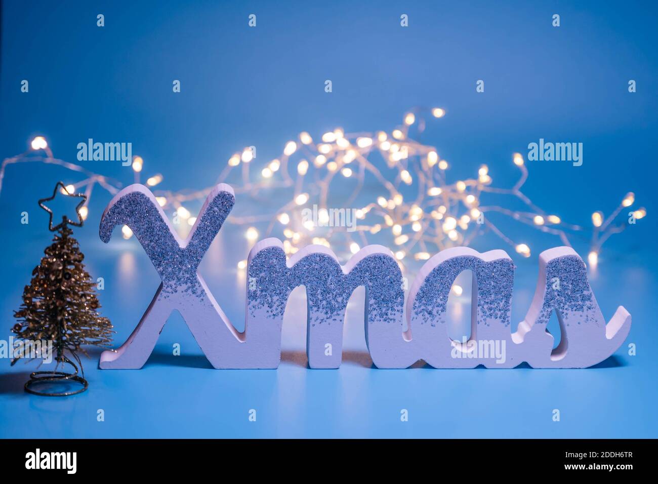 Wood craft blue Christmas background: wooden letters with glitter ...