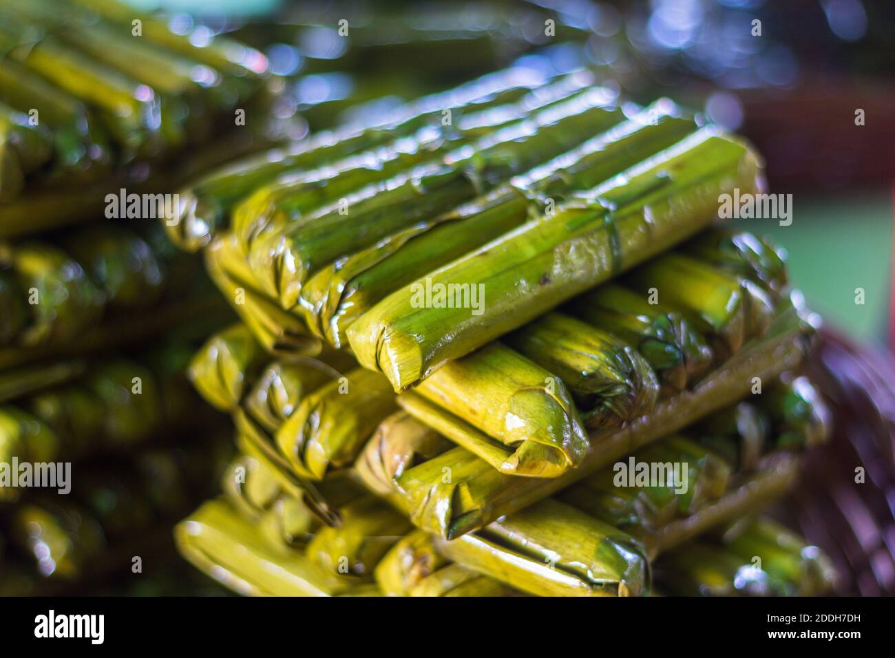 Rice cakes called 'budbud' or suman' wrapped in blanched banana leaves ...