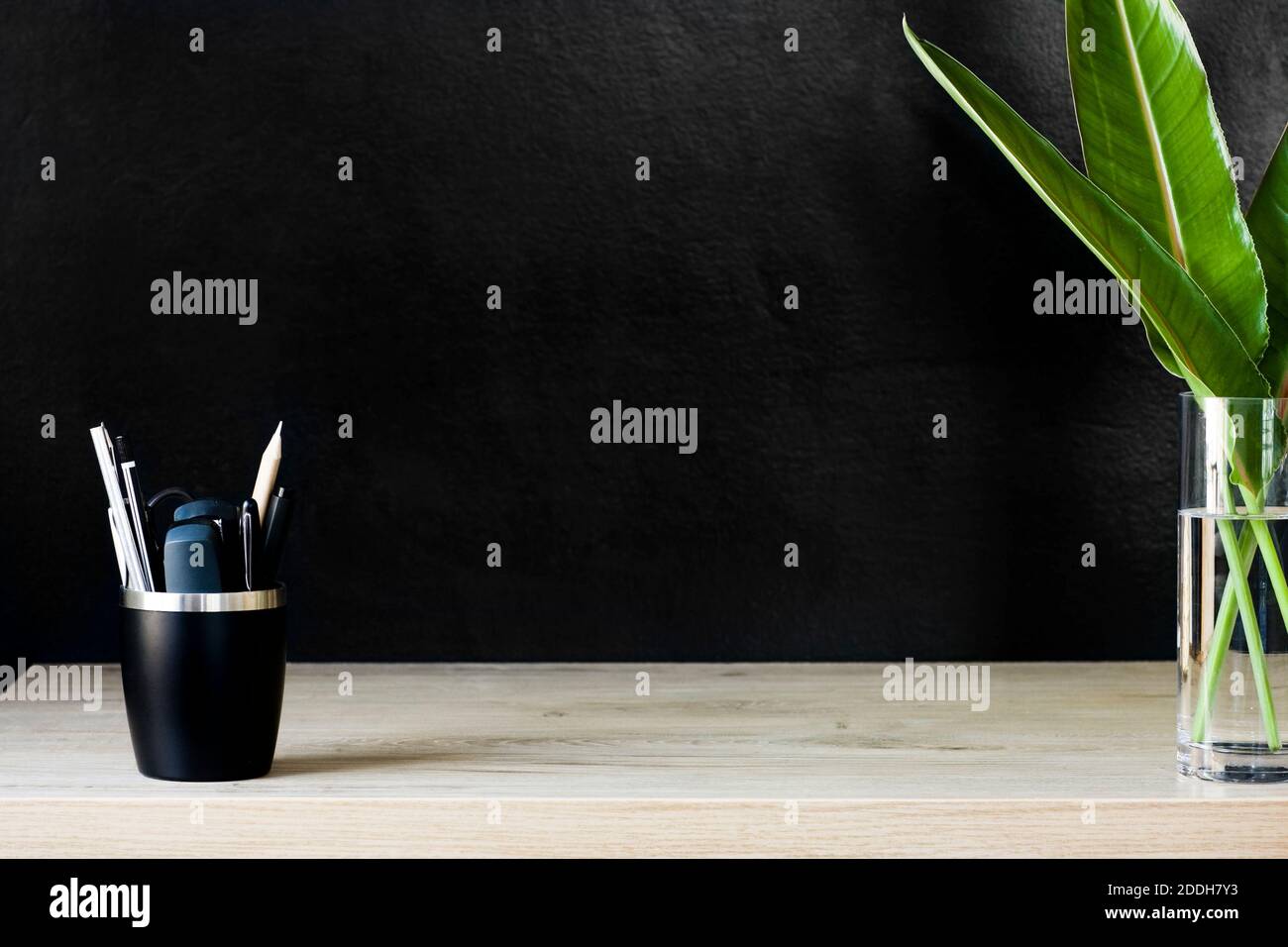 A quiet home office desk equipped with the necessary stationary to work ...