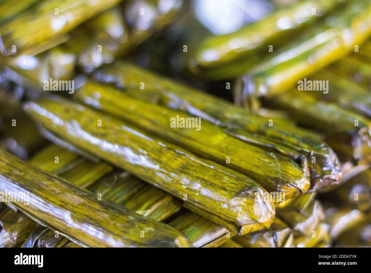 Rice cakes called 'budbud' or suman' wrapped in blanched banana leaves ...