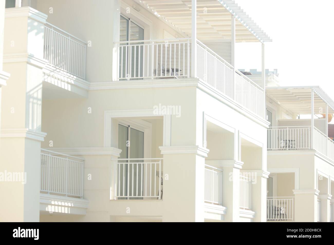 Modern beautiful hotel resort building with white balconies. White ...