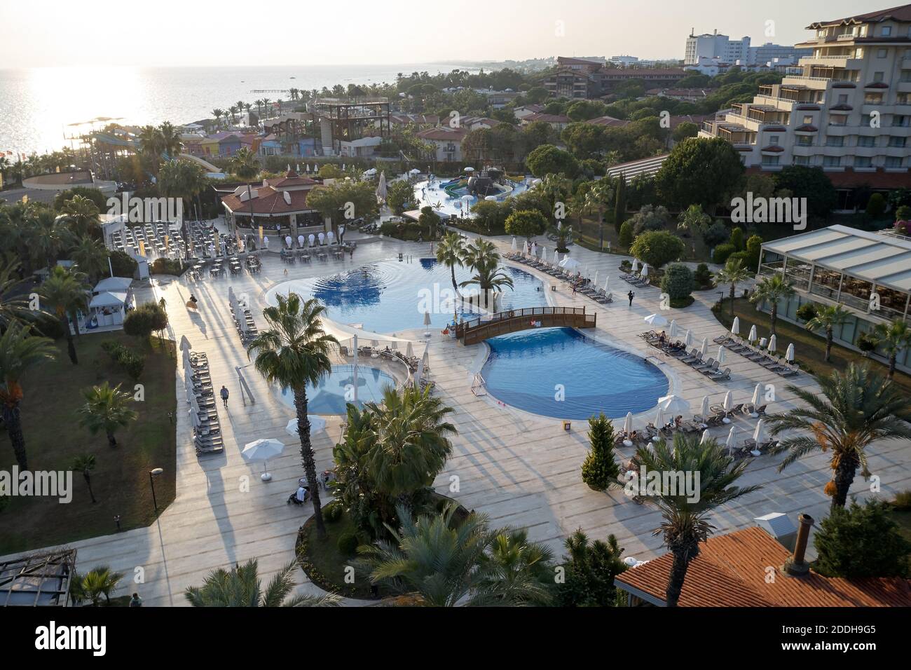 Aerial view of resort hotel with swimming pools. Tourists enjoying ...