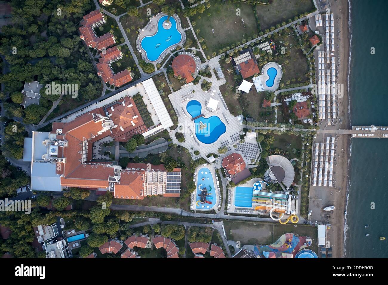 Aerial view of water park and coastline of resort hotel. Drone view of ...