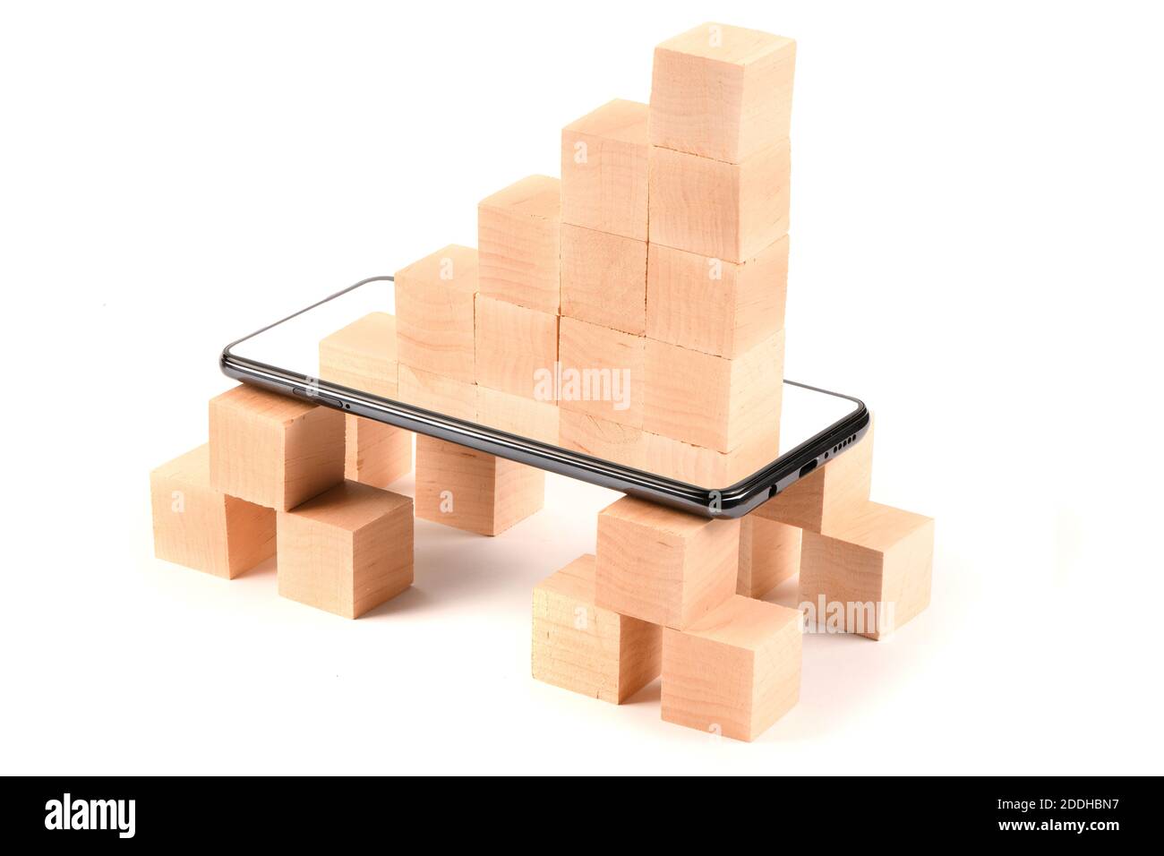 Black mobile smartphone and wooden cubes. Smartphone with blank screen ...