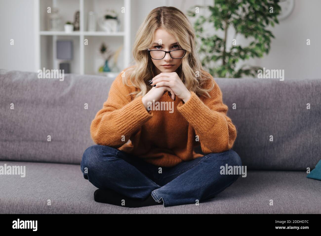 Young woman boring at home Stock Photo - Alamy