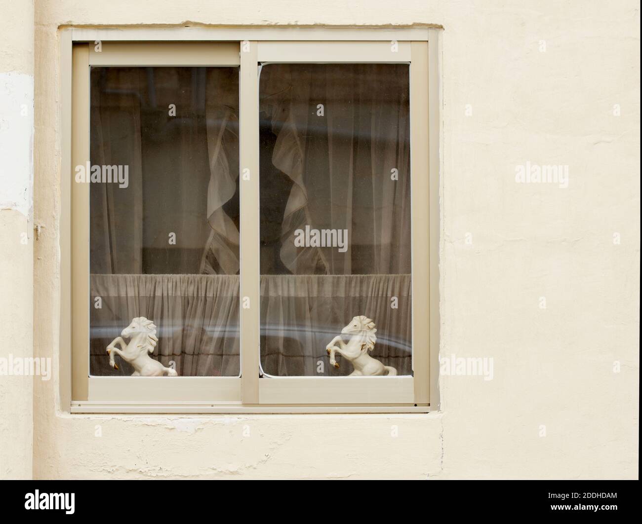 Maltese windows. Fragment photo of old house with ceramic horses in the ...