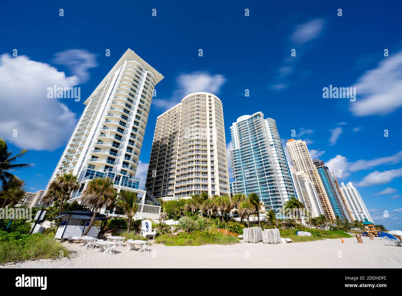 Beach side tall buildings Miami colorful blue sky Stock Photo - Alamy