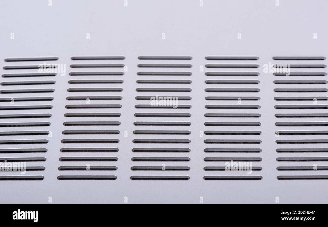 Silver perforated plastic texture with lines Stock Photo - Alamy