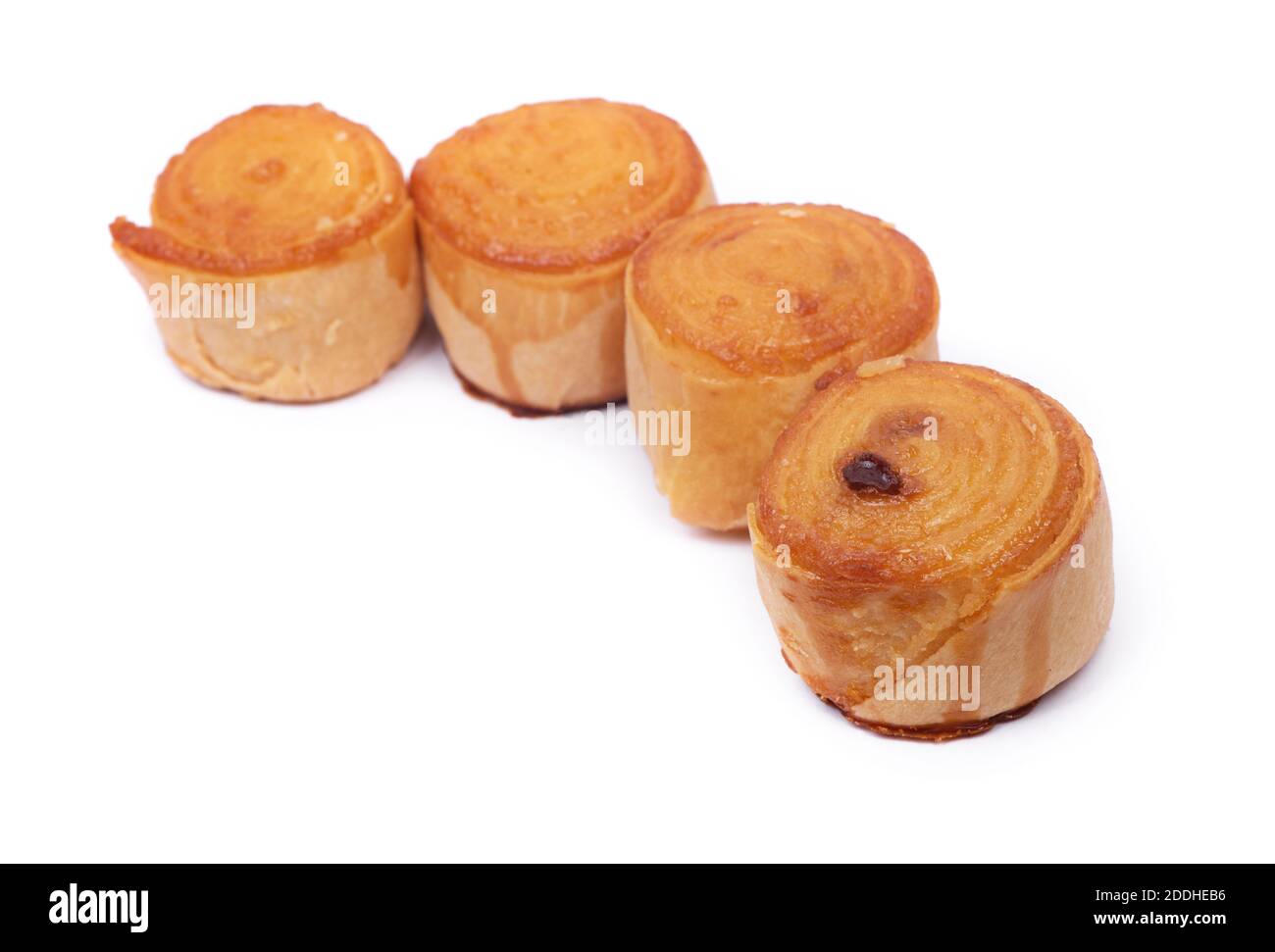 Group of rolled pastries isolated over white background Stock Photo - Alamy