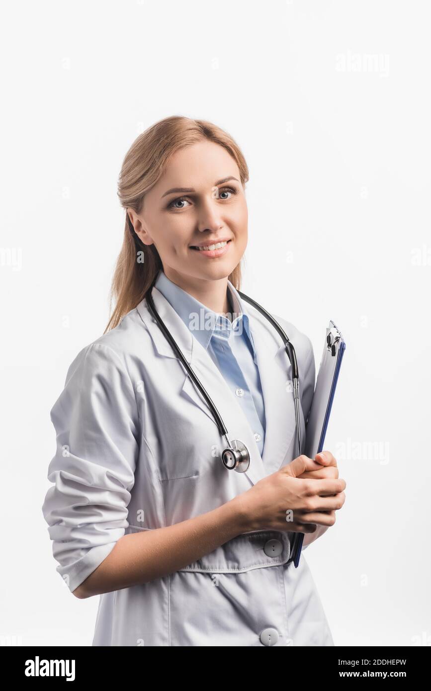 happy nurse in white coat holding clipboard isolated on white Stock ...