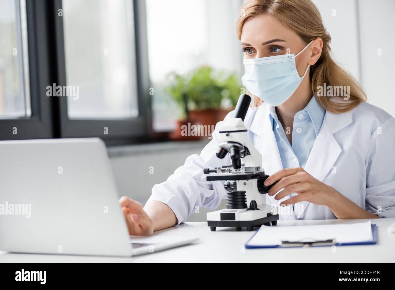Microscope on workplace near hi-res stock photography and images - Alamy