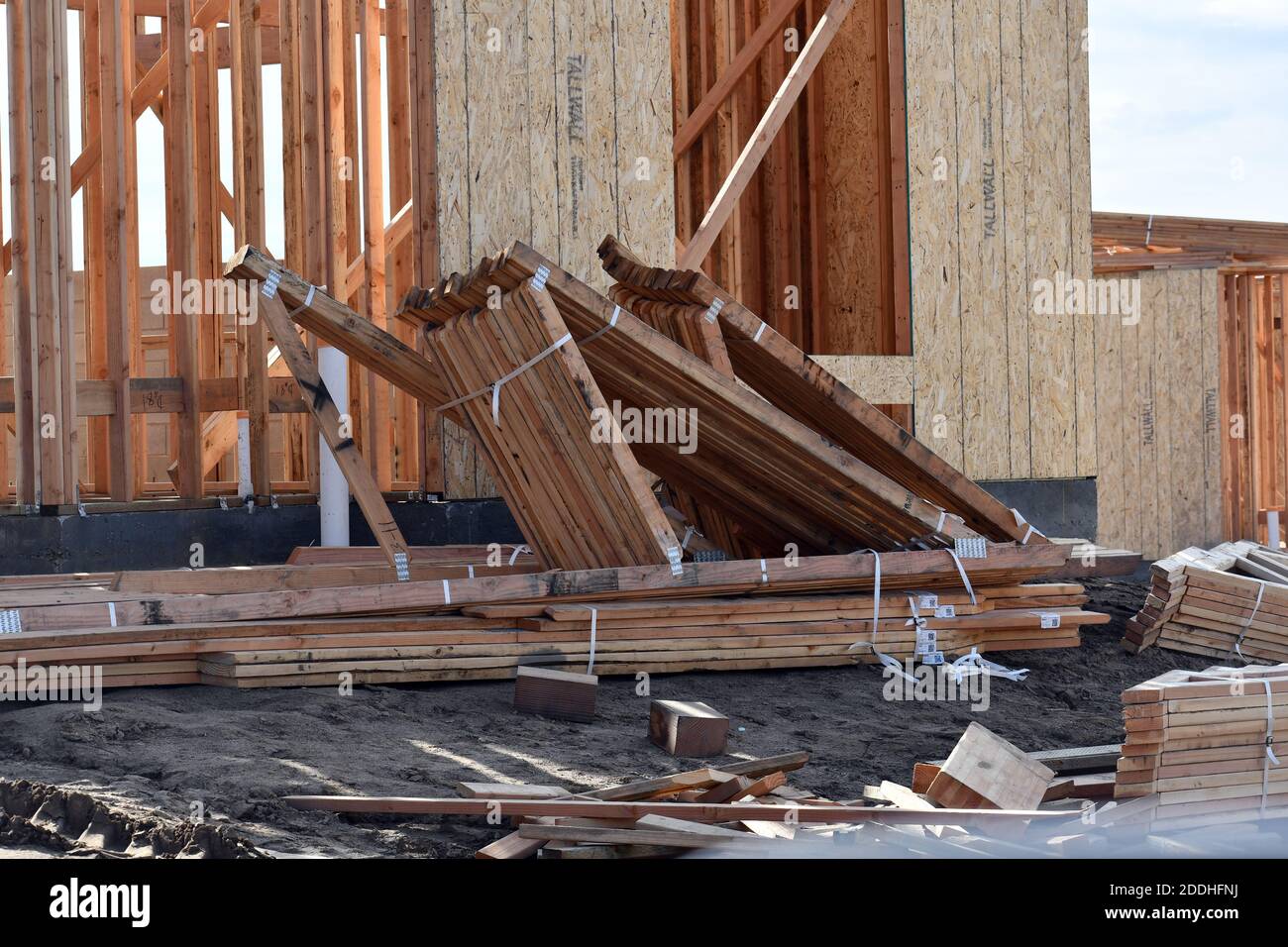 A new house construction site with wooden planks and other working ...