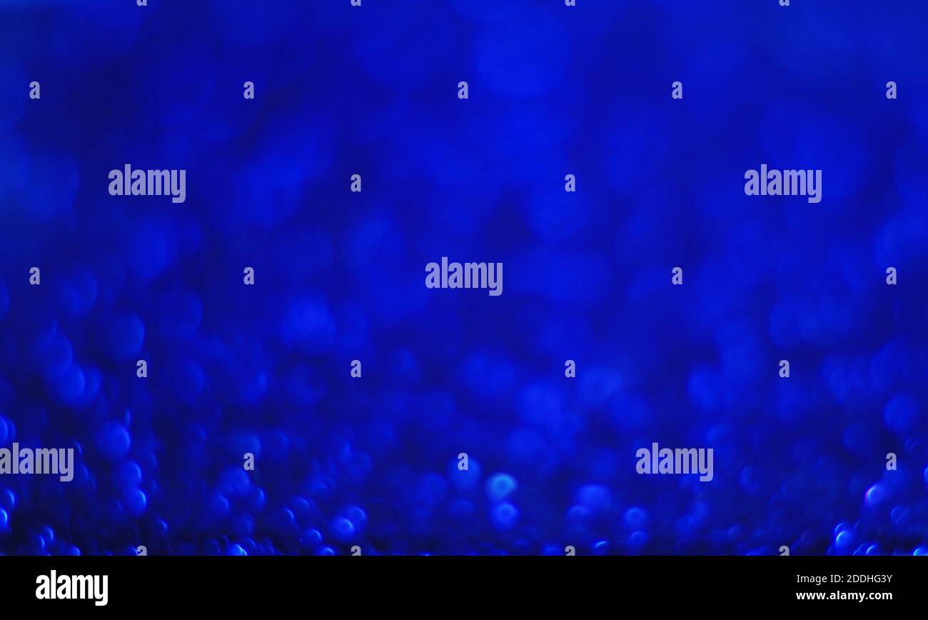 Abstract blue background with sparkling bokeh lights Stock Photo - Alamy