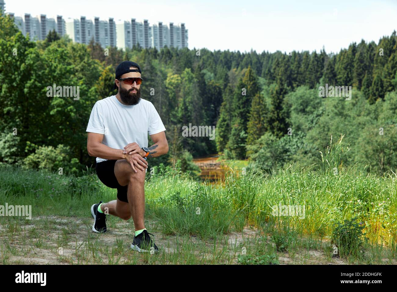 Bearded athletic man doing workout exercise in the outdoor gym in ...