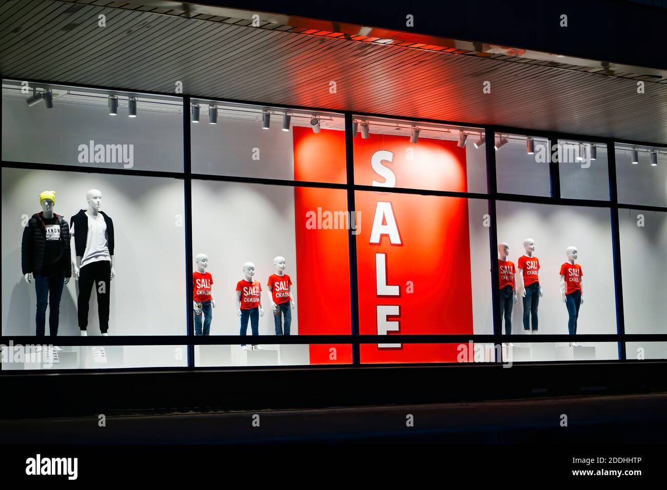 Orange color of sales banner in store window Stock Photo - Alamy