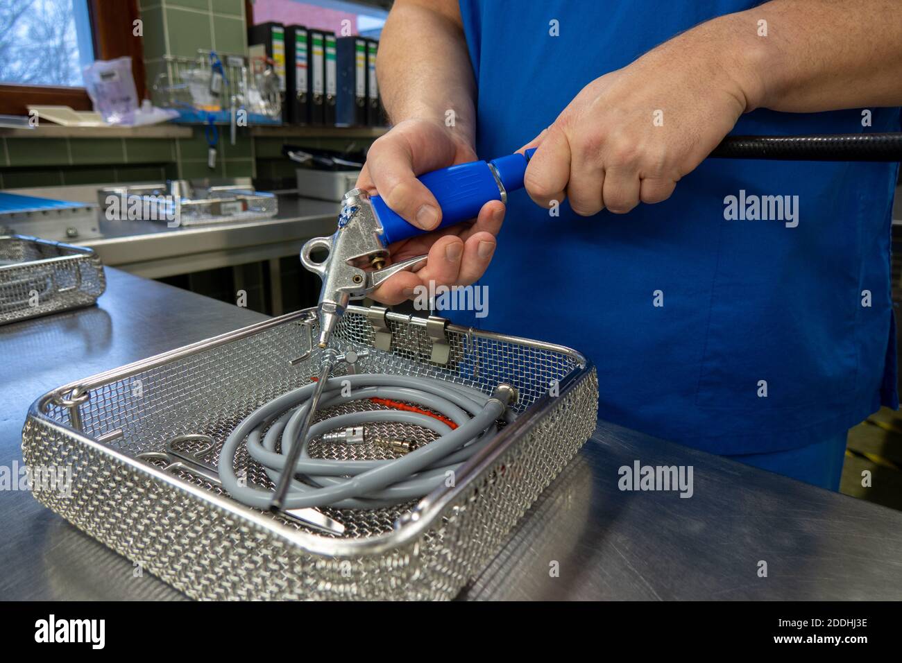 Surgical instruments are blown off with the aid of compressed air Stock ...