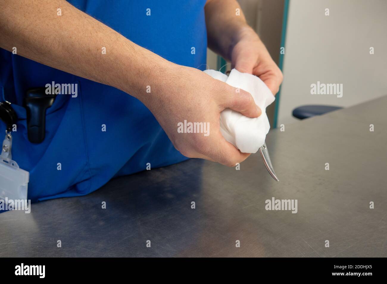 a surgical instrument is cleaned with a white cloth Stock Photo - Alamy