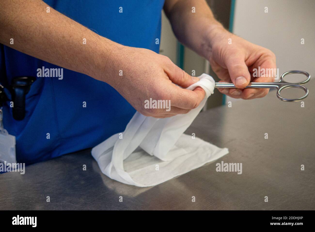 a surgical instrument is cleaned with a white cloth Stock Photo - Alamy