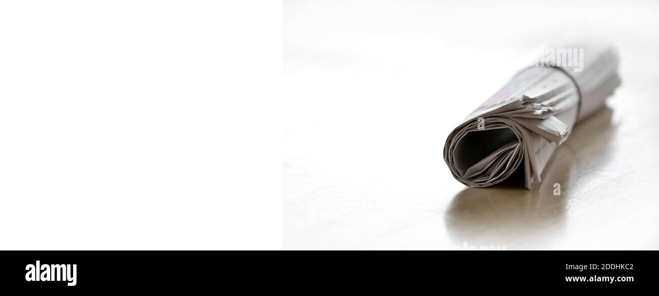 Rolled up newspaper hi-res stock photography and images - Alamy
