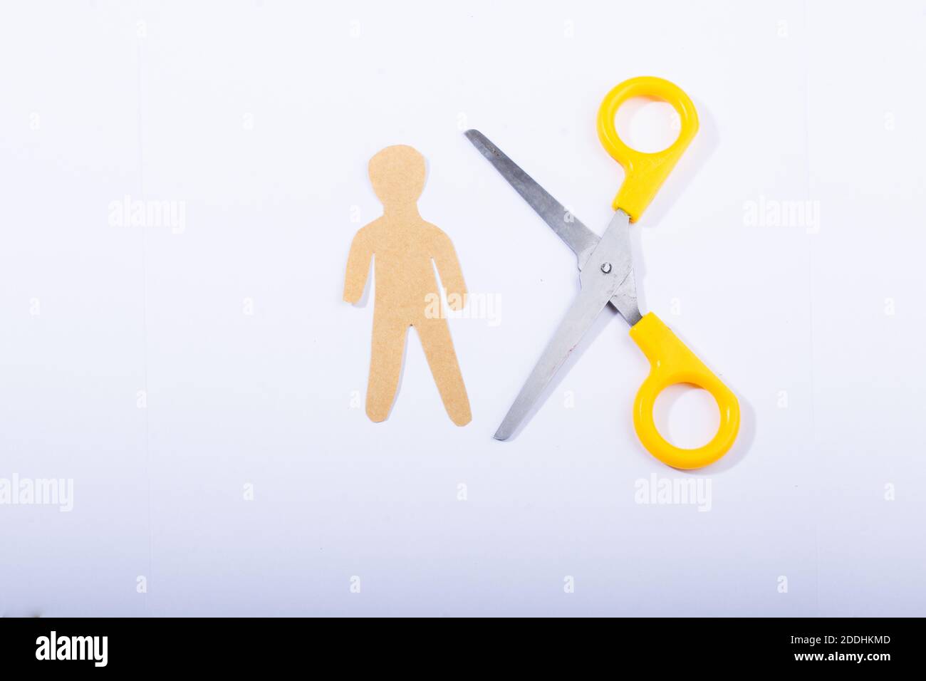 Man shape cut out of paper in view Stock Photo - Alamy