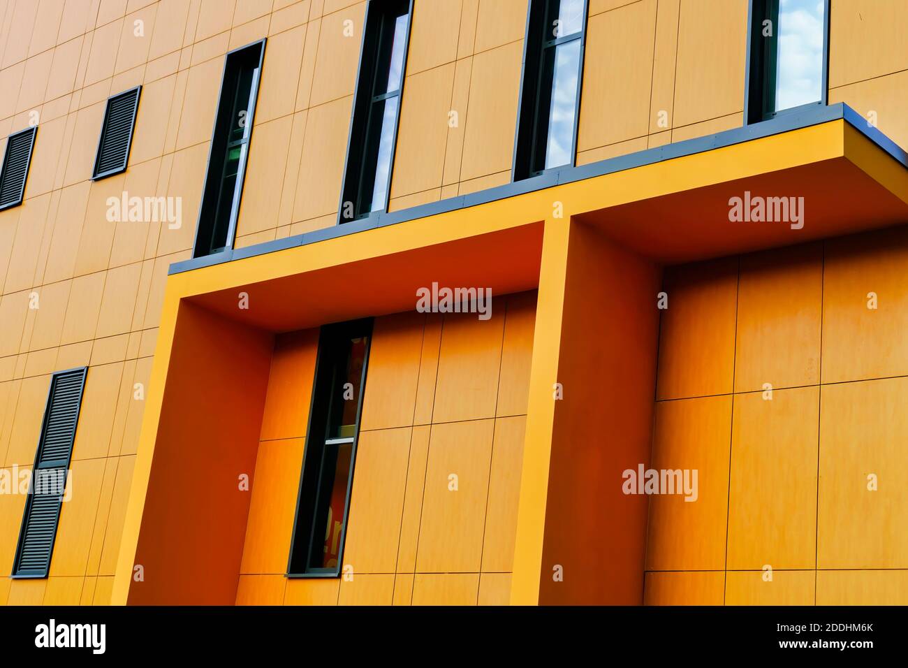 Geometry of yellow modern residential building facade Stock Photo - Alamy