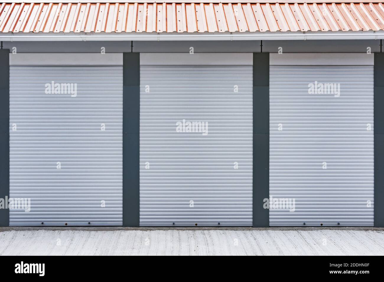 Metal gray gates of the shop storage Stock Photo - Alamy