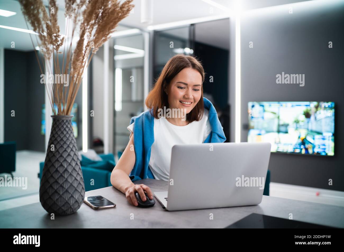 Portrait of gamer girl playing online game on a laptop from home Stock ...