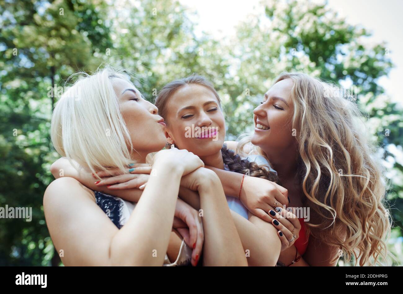 Girlfriends having fun in downtown Stock Photo - Alamy