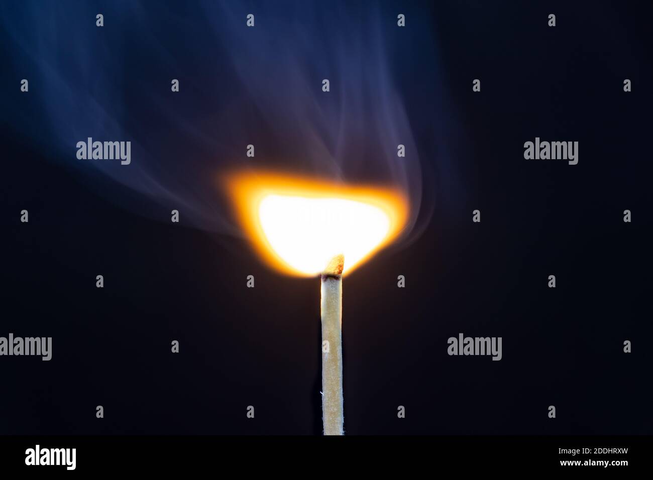 Single matchstick start on fire isolated on black background Stock ...