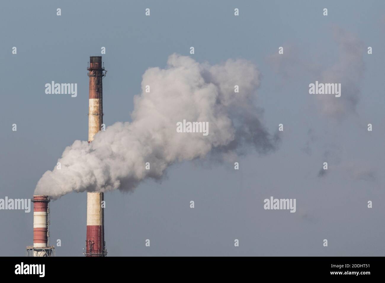 Tops of two chimneys and smoke Stock Photo - Alamy