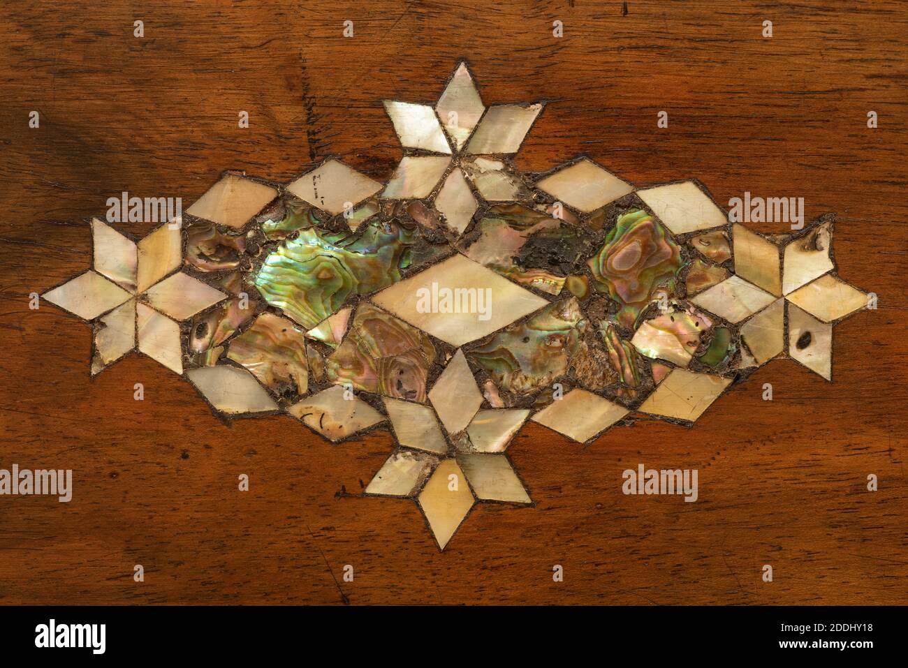 Mother of pearl inlay in Burr Walnut veneer showing iridescent detail ...