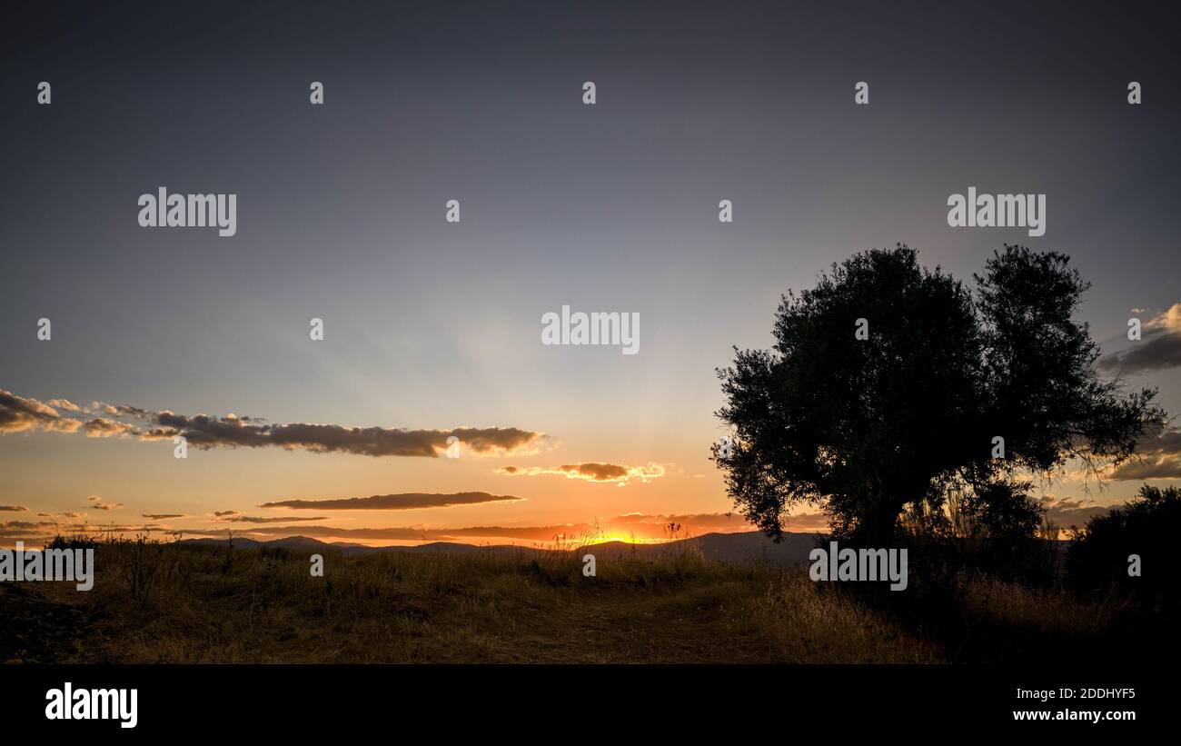 A beautiful landscape of a valley at sunset Stock Photo - Alamy
