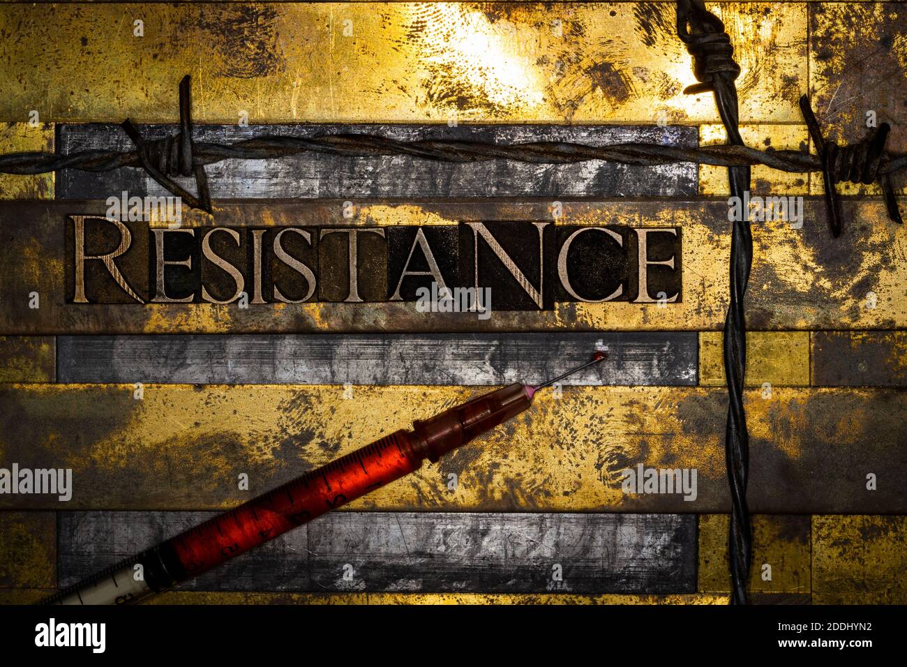 Resistance text message on textured lead grunge copper and vintage gold ...