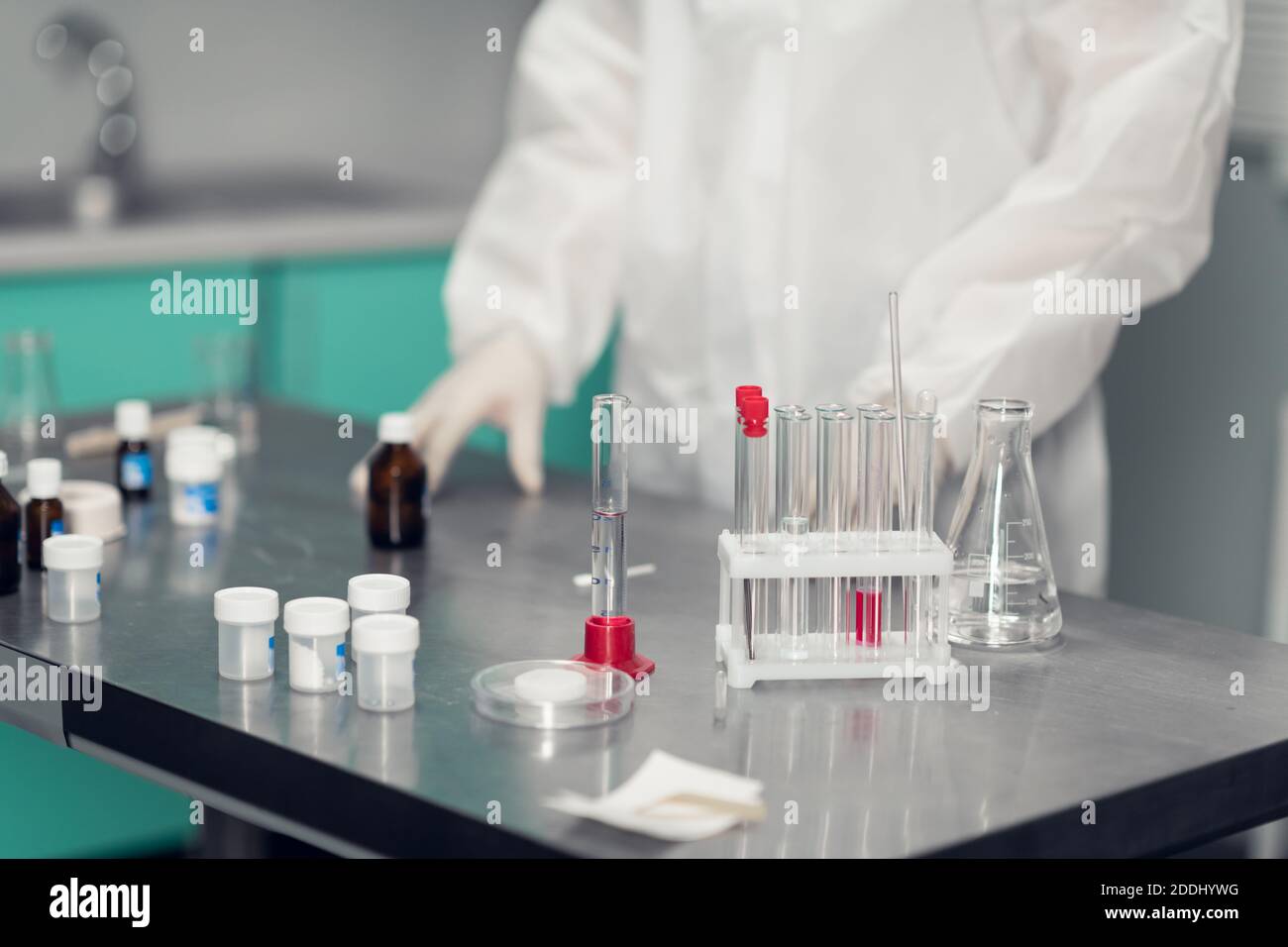 Scientists hands on the lab table. Chemical laboratory in action. A ...