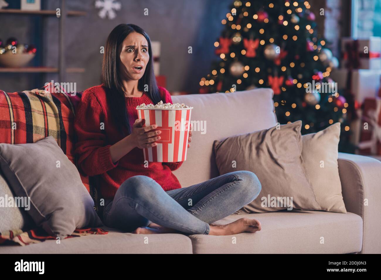 Photo of young beautiful scared shocked afraid woman hold pop corn ...