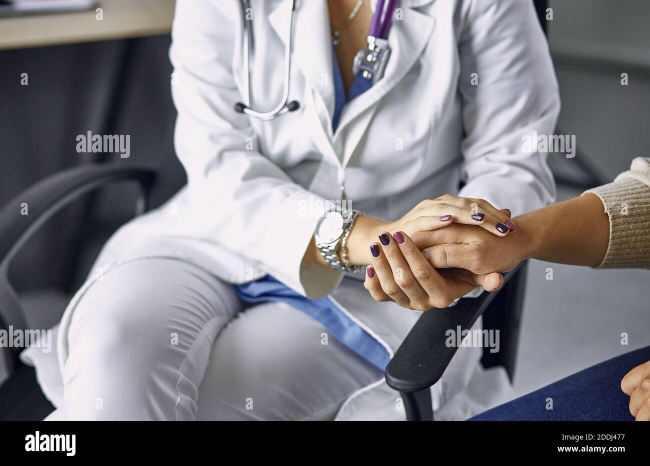 Doctor aiding patient hi-res stock photography and images - Alamy