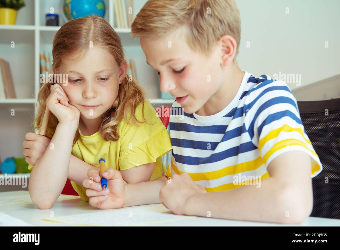 Cute clever schoolchildren are came back to school and studying ...