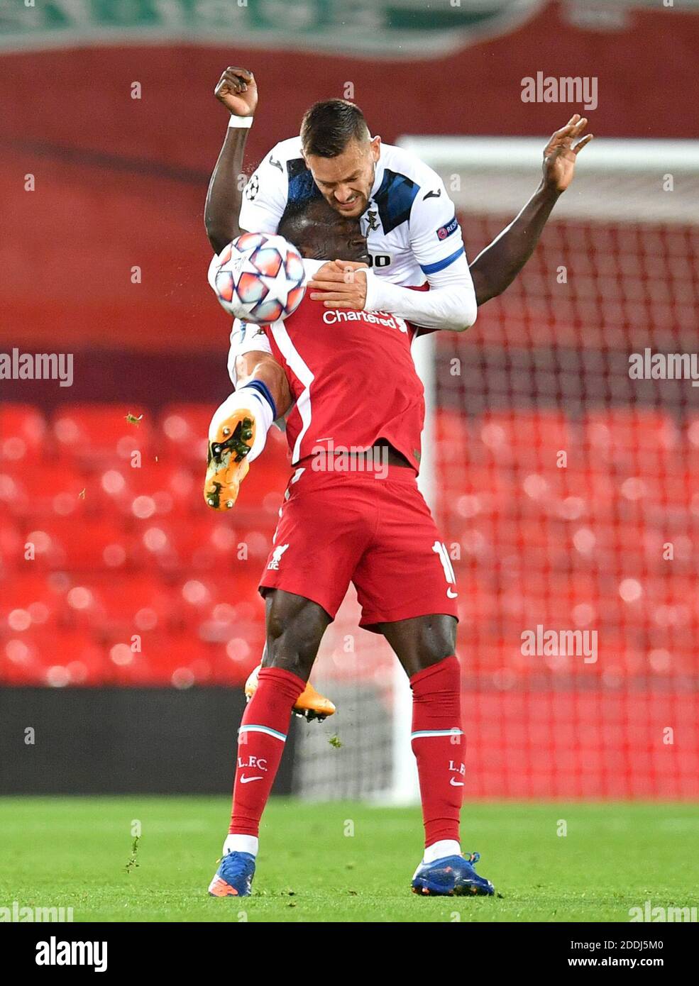Liverpool's Sadio Mane (bottom) and Atalanta's Rafael Toloi battle for ...