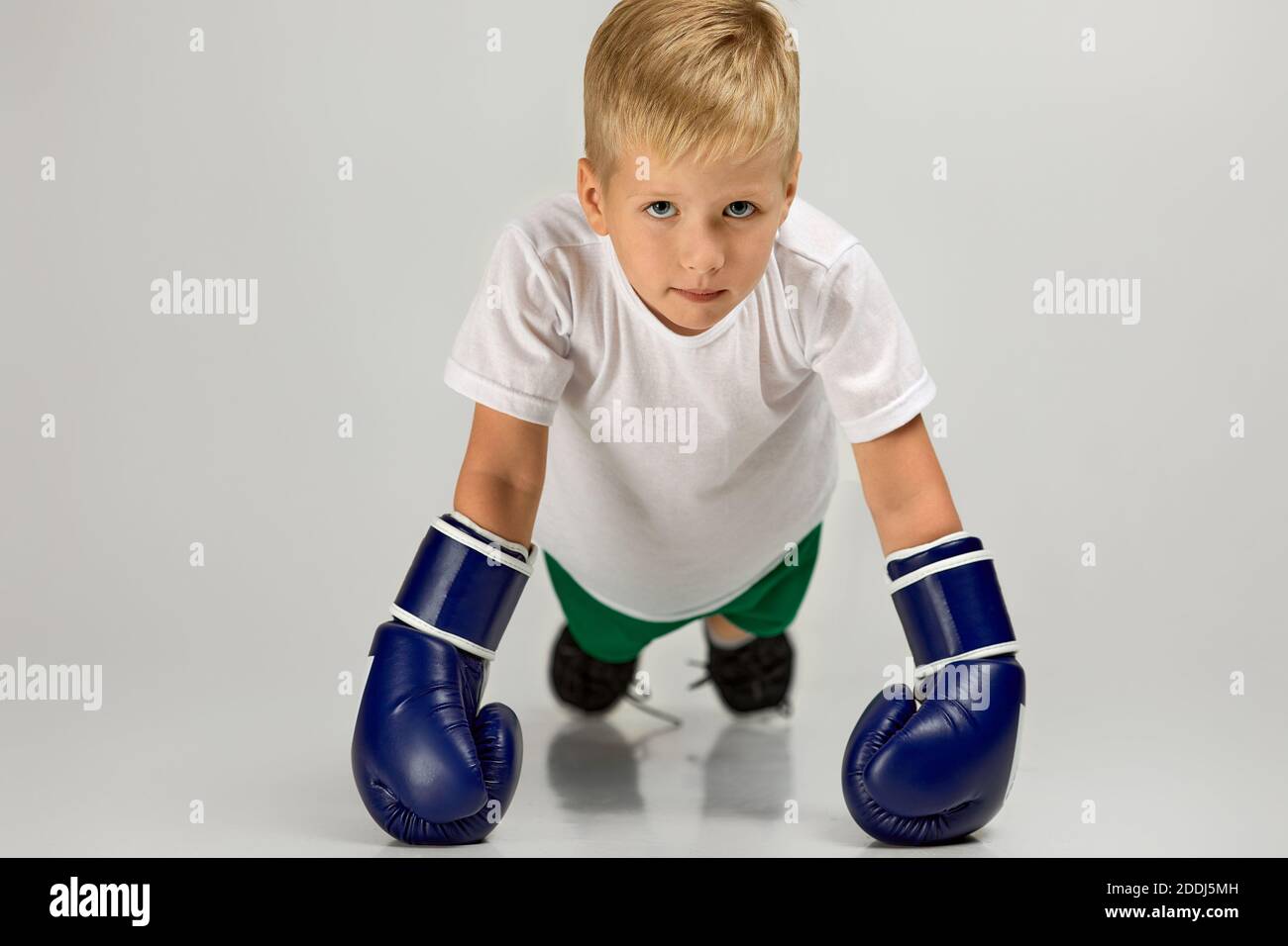 little boxing fighter boy in blue boxer gloves Stock Photo - Alamy