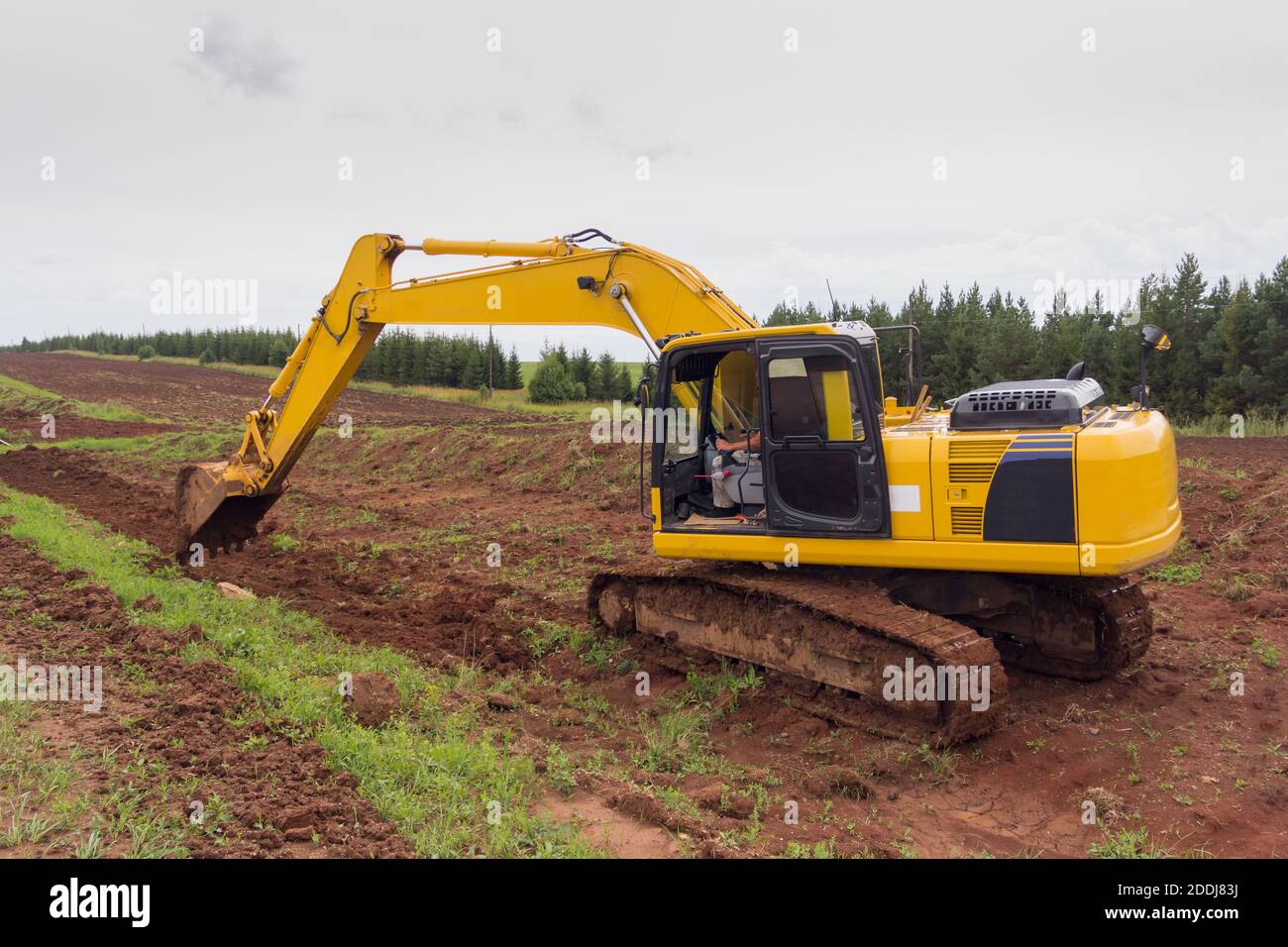 Crawler Excavator digging bucket on construction of road. Construction ...