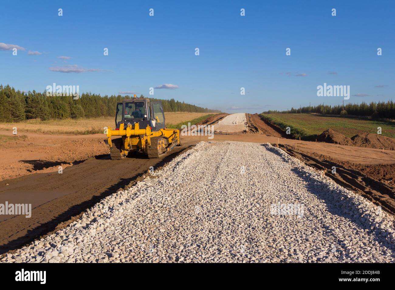 Bulldozer during road construction. Construction machinery. Earth ...