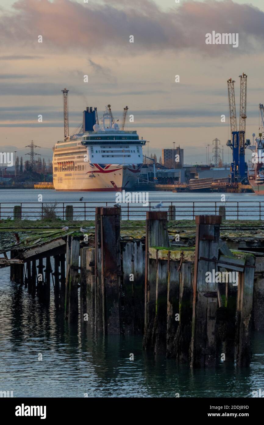 a cruise liner alongside in the port of Southampton docks at sunset ...