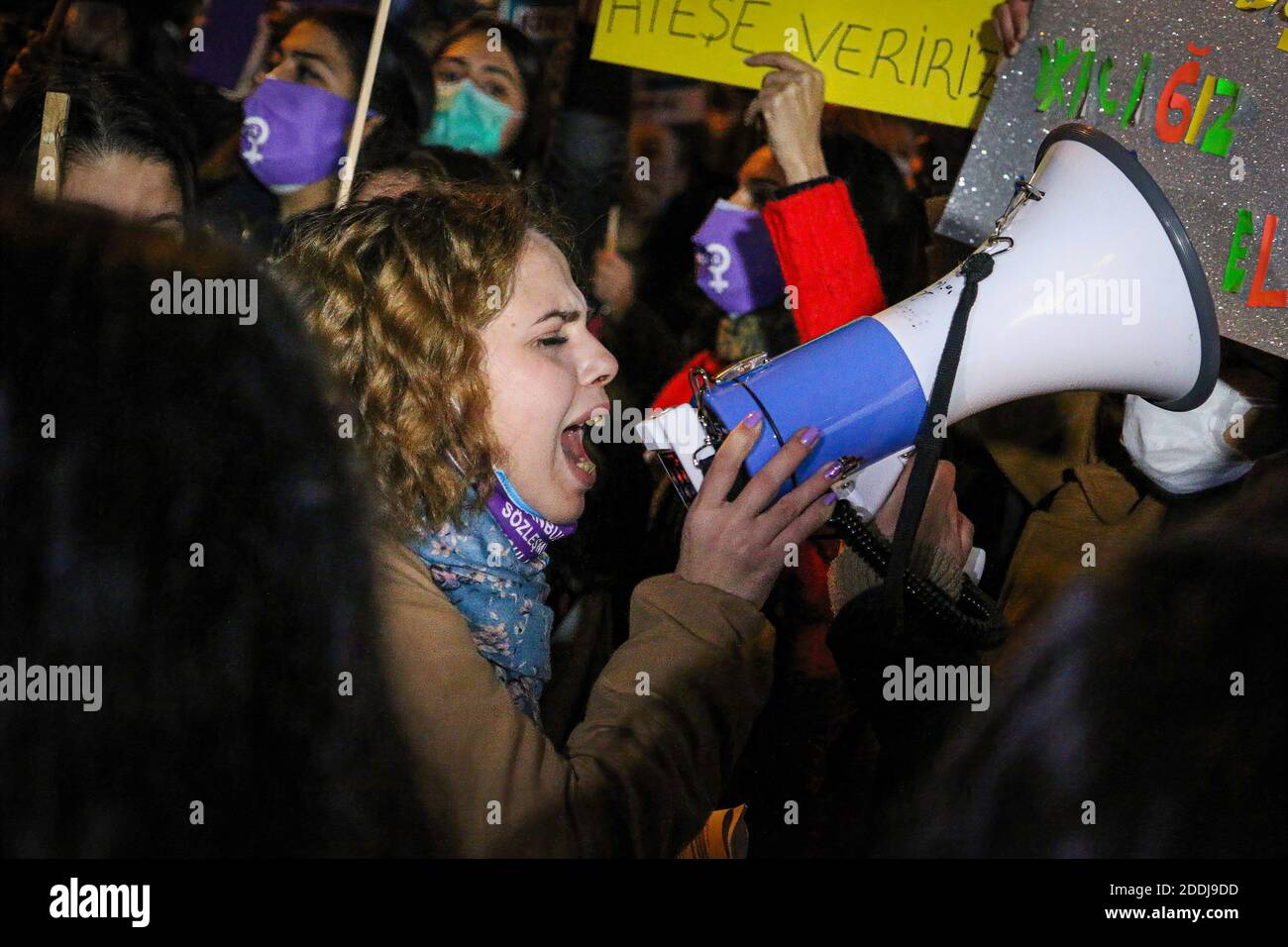 A woman chants slogans on a megaphone during the demonstration.Women in ...