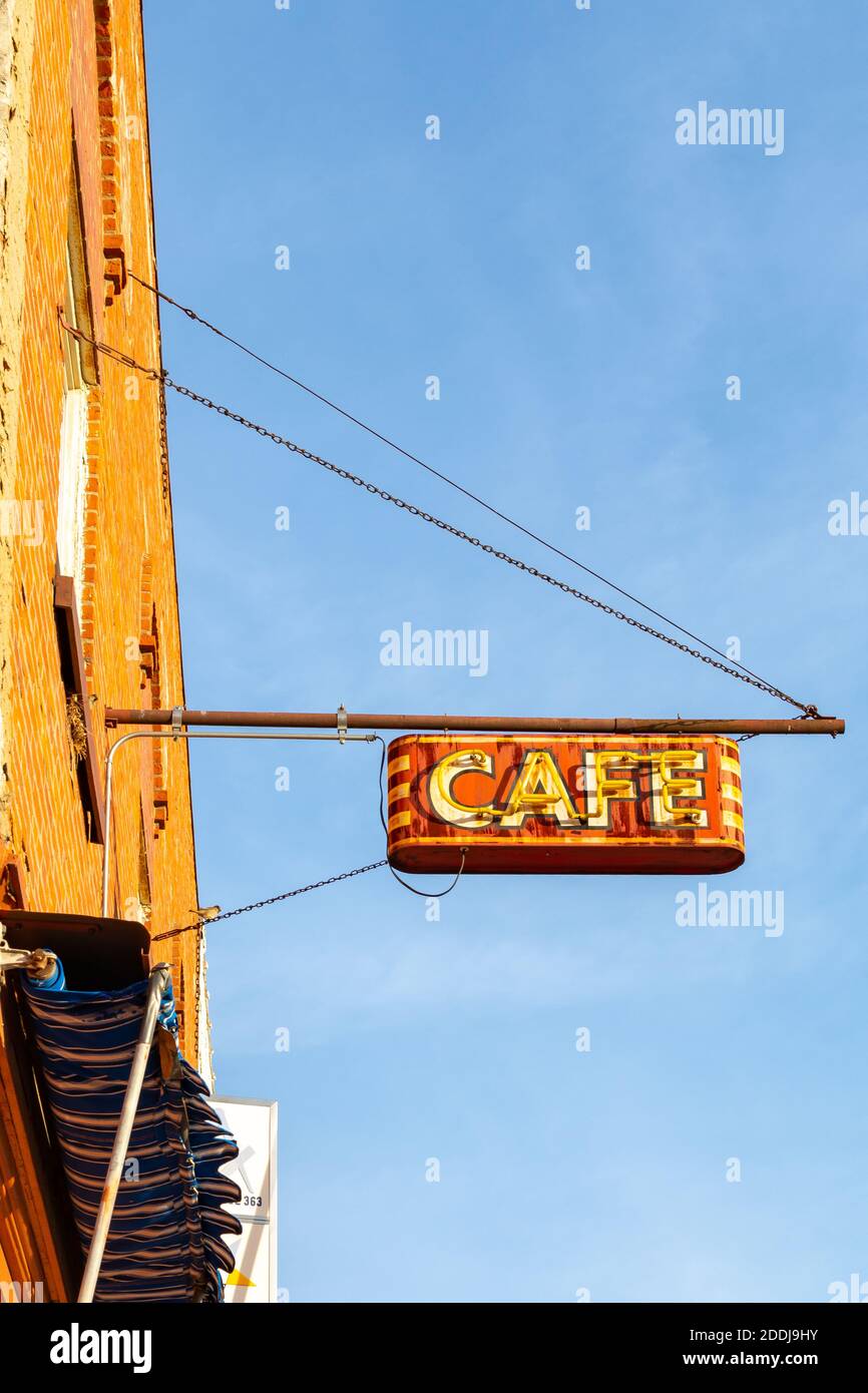 Vintage hanging metal café sign with neon lighting Stock Photo - Alamy