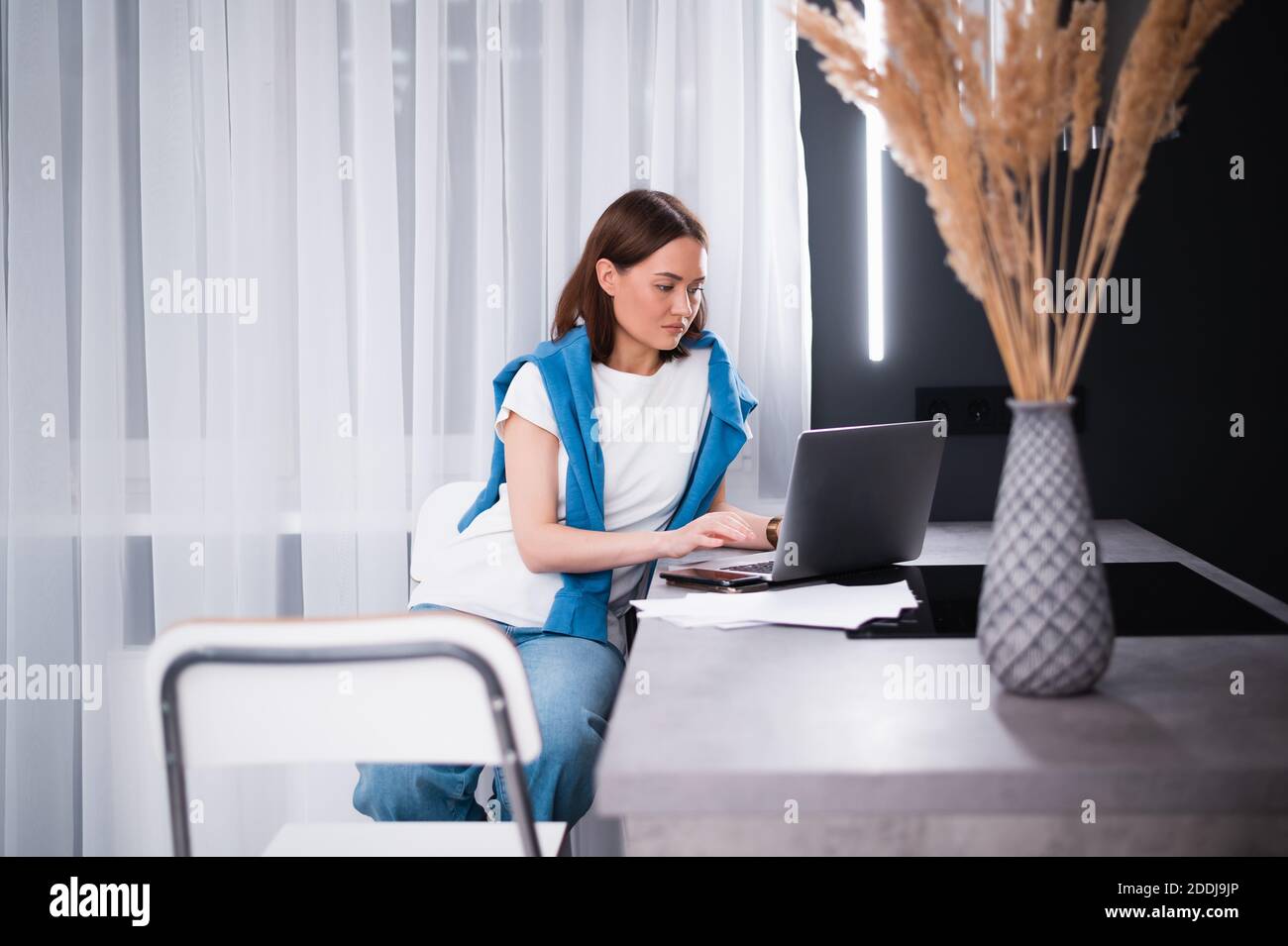 Woman working focused on laptop hi-res stock photography and images - Alamy