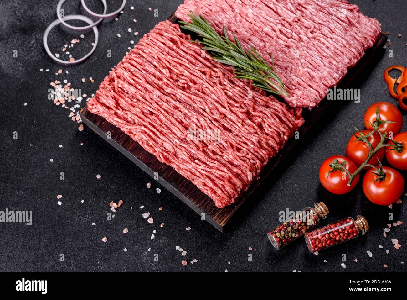 Fresh raw beef mince on a dark background. Preparation for cooking of ...
