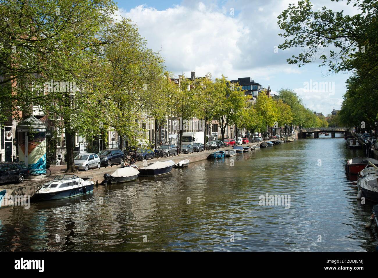 Boats line the many canals in downtown Amsterdam, Netherlands Stock ...