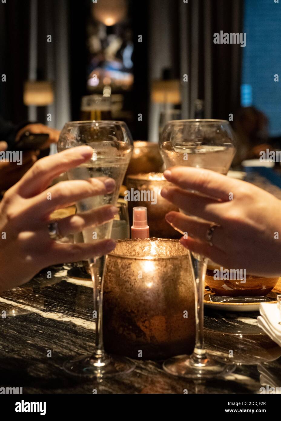 A celebration of marriage by raising 2 glasses Stock Photo - Alamy